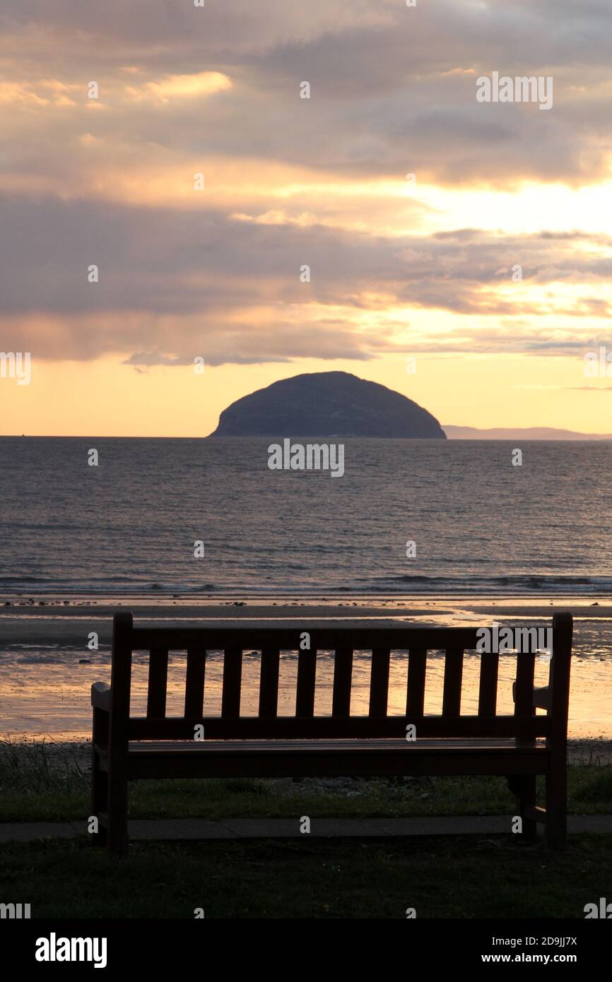 Ailsa Craig, Carrick, Ayrshire, Scotland, UK With bench in foregrond, a ...