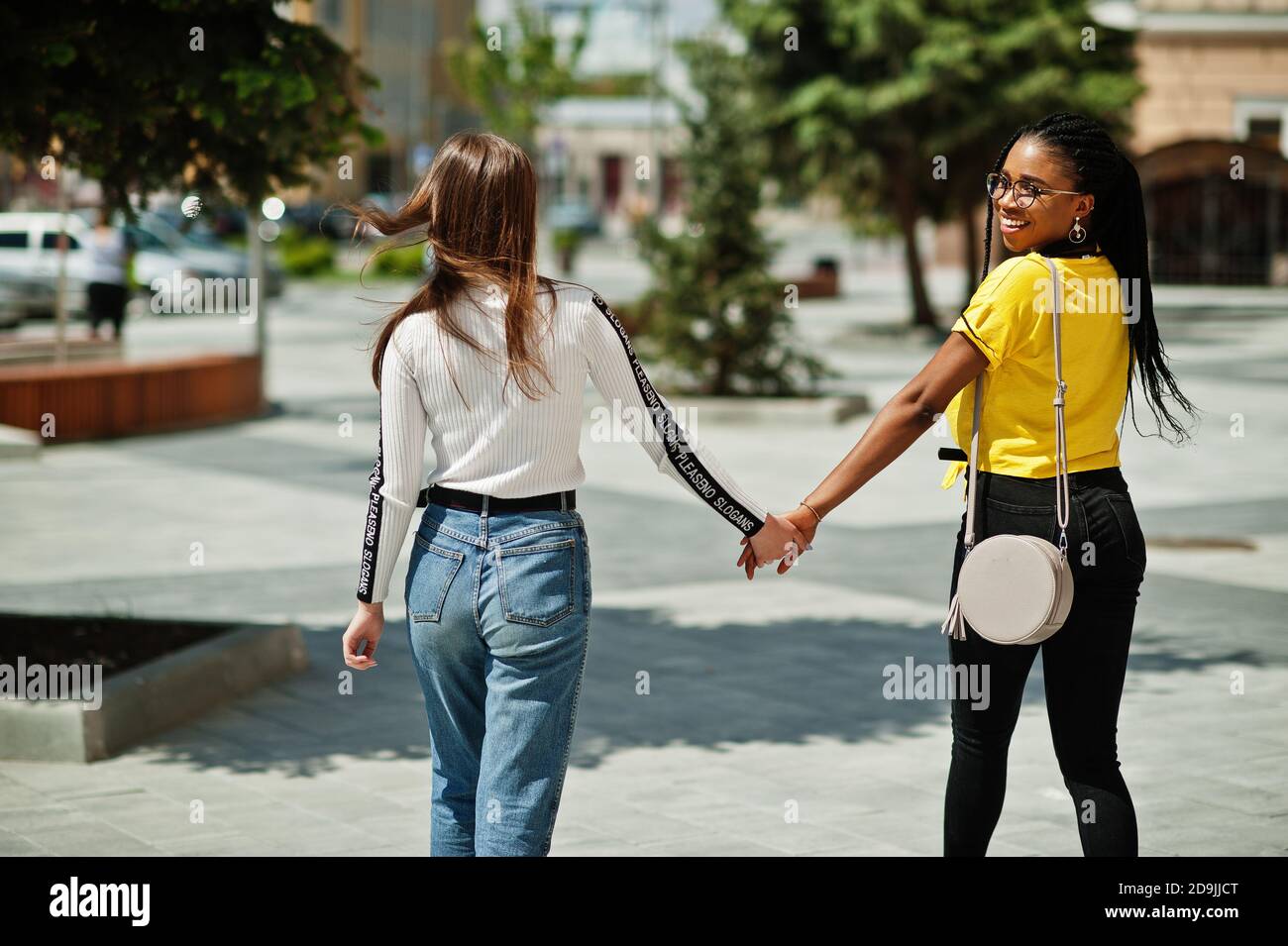 Different races holding hands hi-res stock photography and images - Alamy