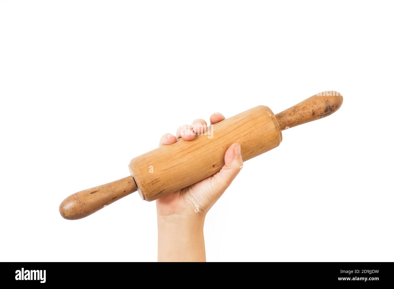Woman hand holding a rolling pin on a white background Stock Photo - Alamy