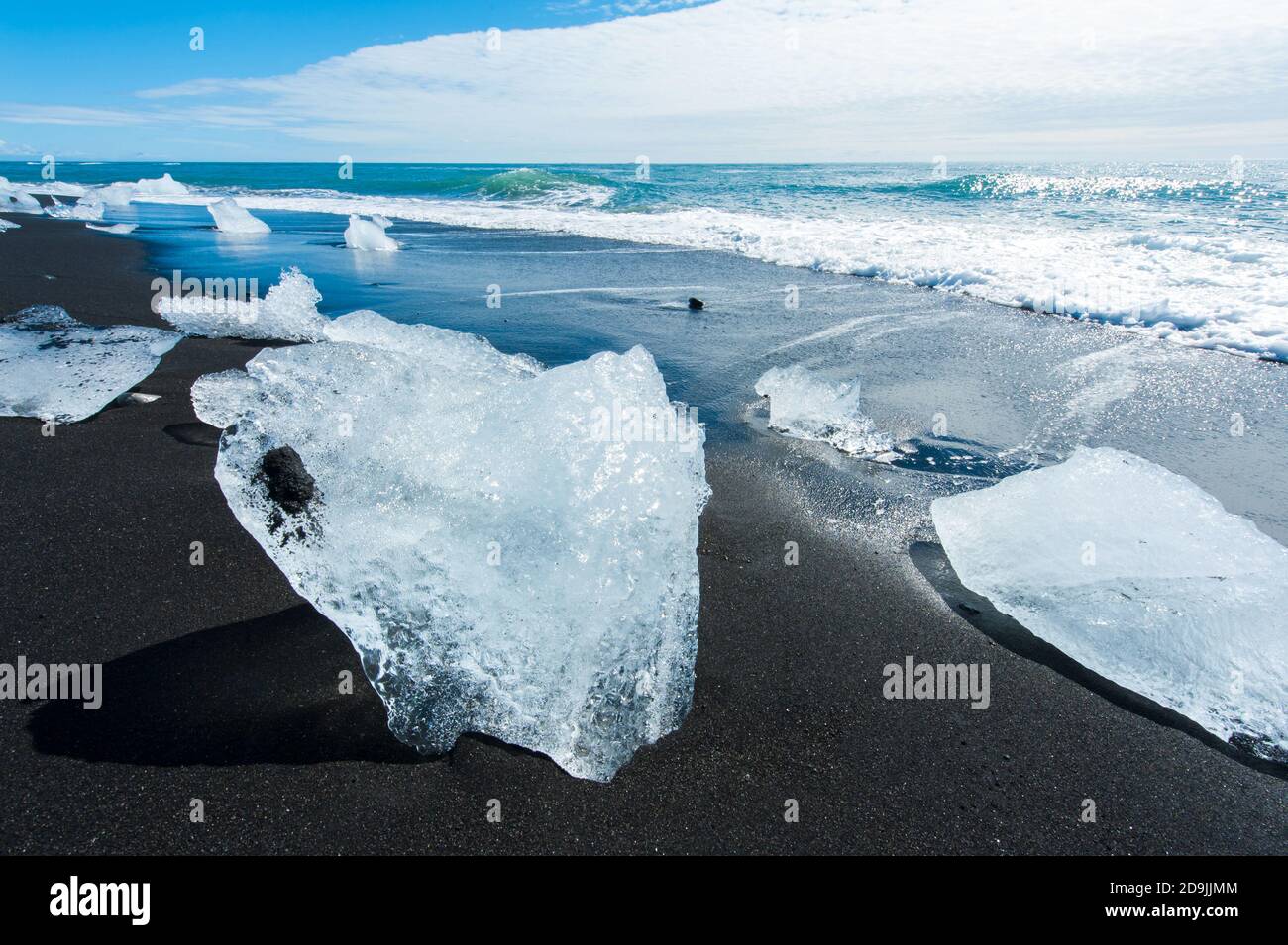 Beautiful beach in the South of Iceland with a black lava sand is full ...