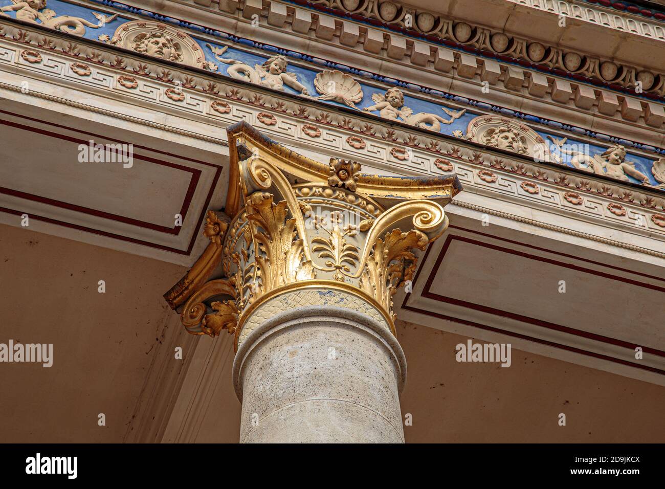 Top part of pillar, Greek-style columns with golden top Stock Photo - Alamy
