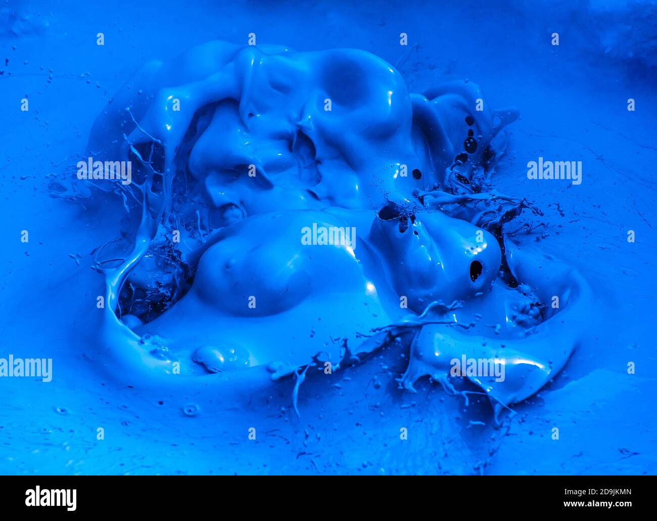 Vivid blue splash frozen high speed photo Stock Photo - Alamy