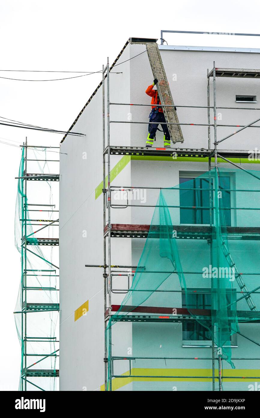 demolition of scaffolding after insulation and renovation of the ...
