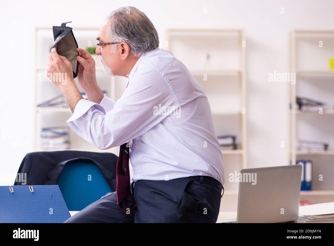 Old businessman in bankruptcy concept Stock Photo - Alamy