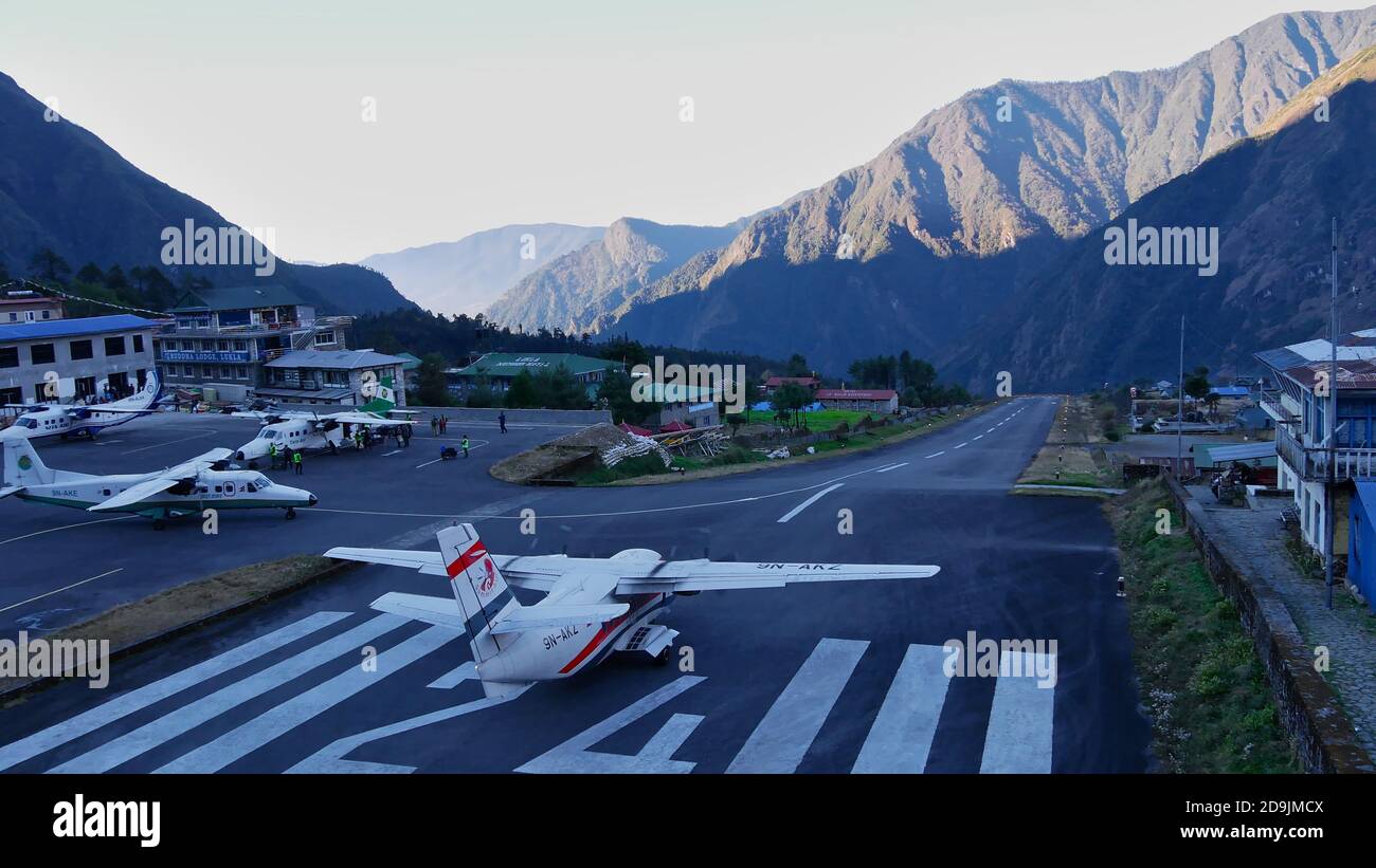 Lukla, Nepal - 11/28/2019: Busy scene with planes ready for take off on ...