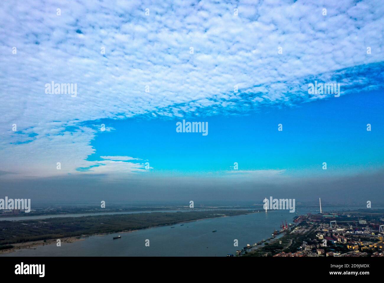 A cloud boundary line of "half blue sky and half white clouds" appears ...