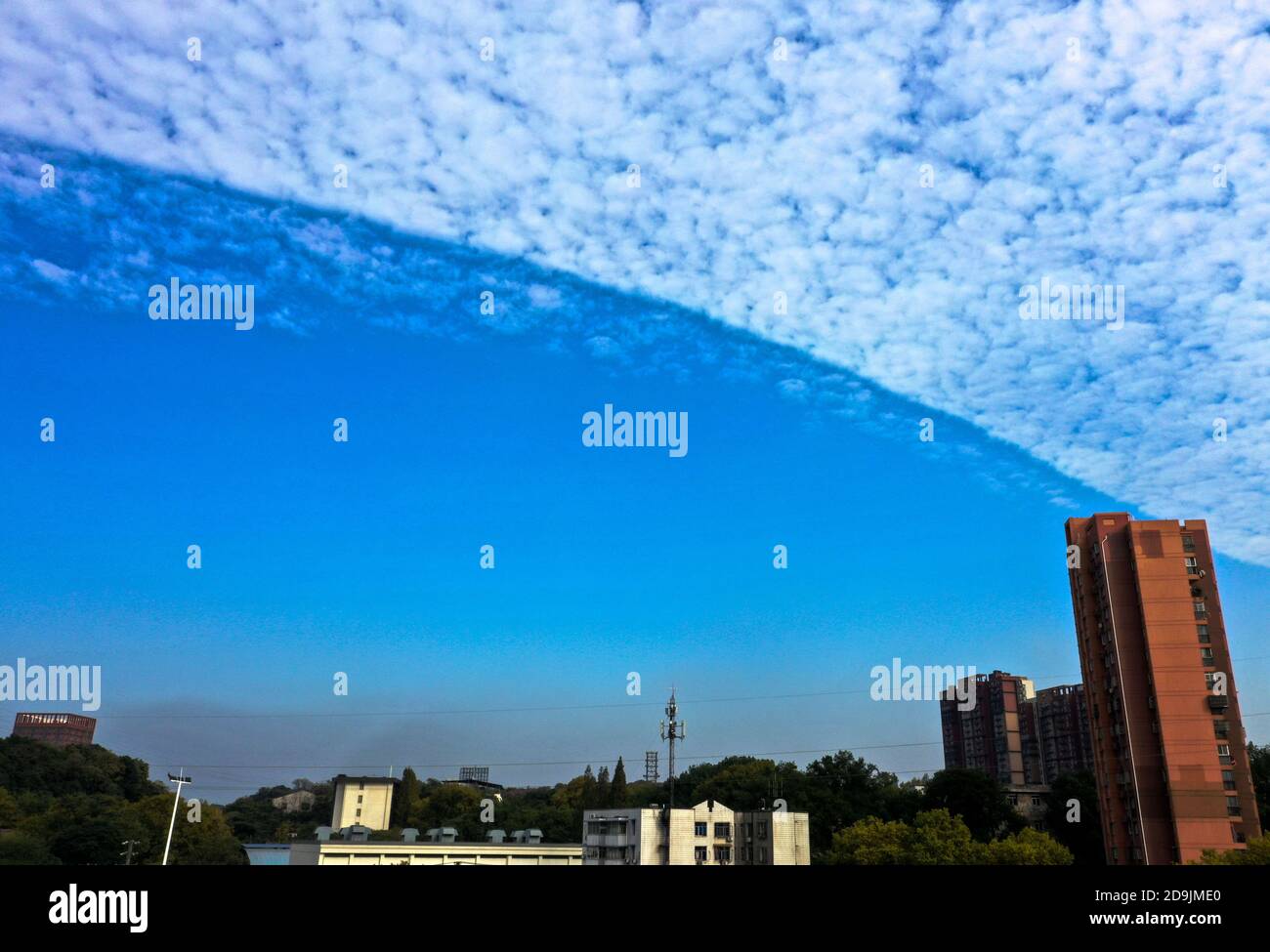 A cloud boundary line of "half blue sky and half white clouds" appears ...