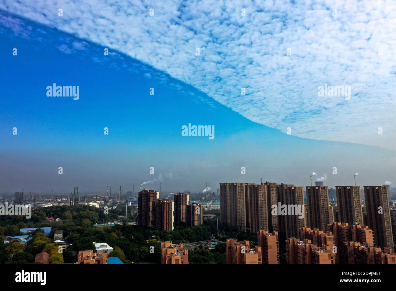 A cloud boundary line of "half blue sky and half white clouds" appears ...