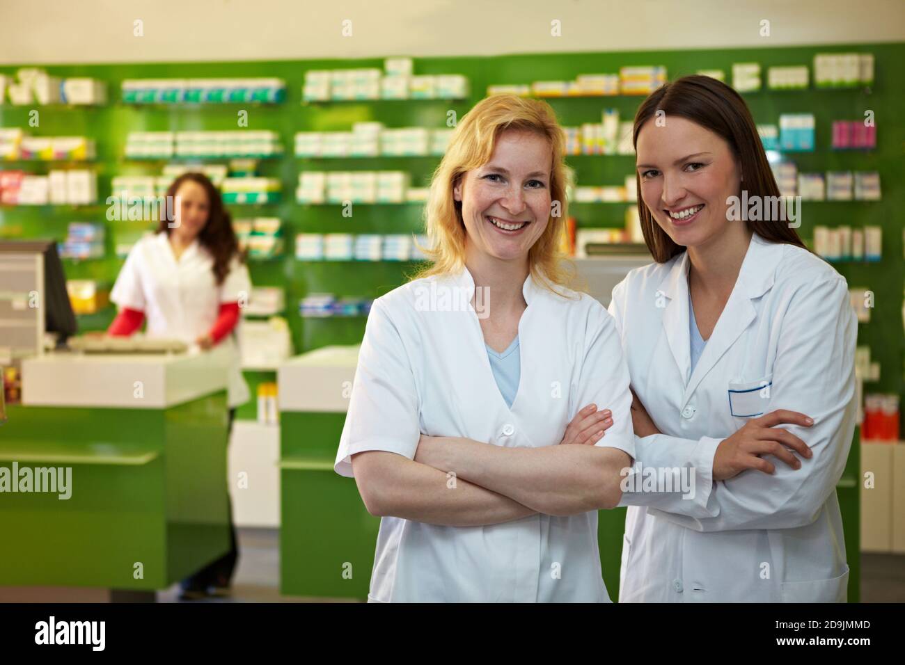 Two laughing pharmacists are happy in a pharmacy Stock Photo - Alamy