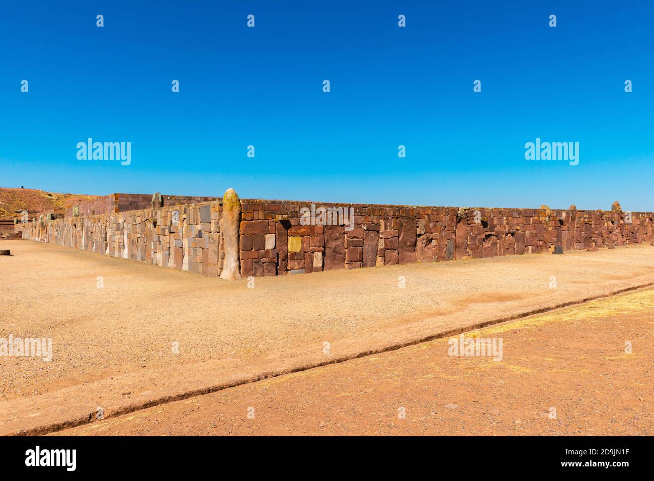 Stone wall surrounding Kalasaya Temple, archeological site Tiwanaku or ...