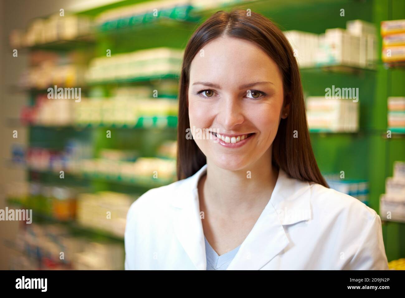 Pharmacist stands behind counter hi-res stock photography and images ...