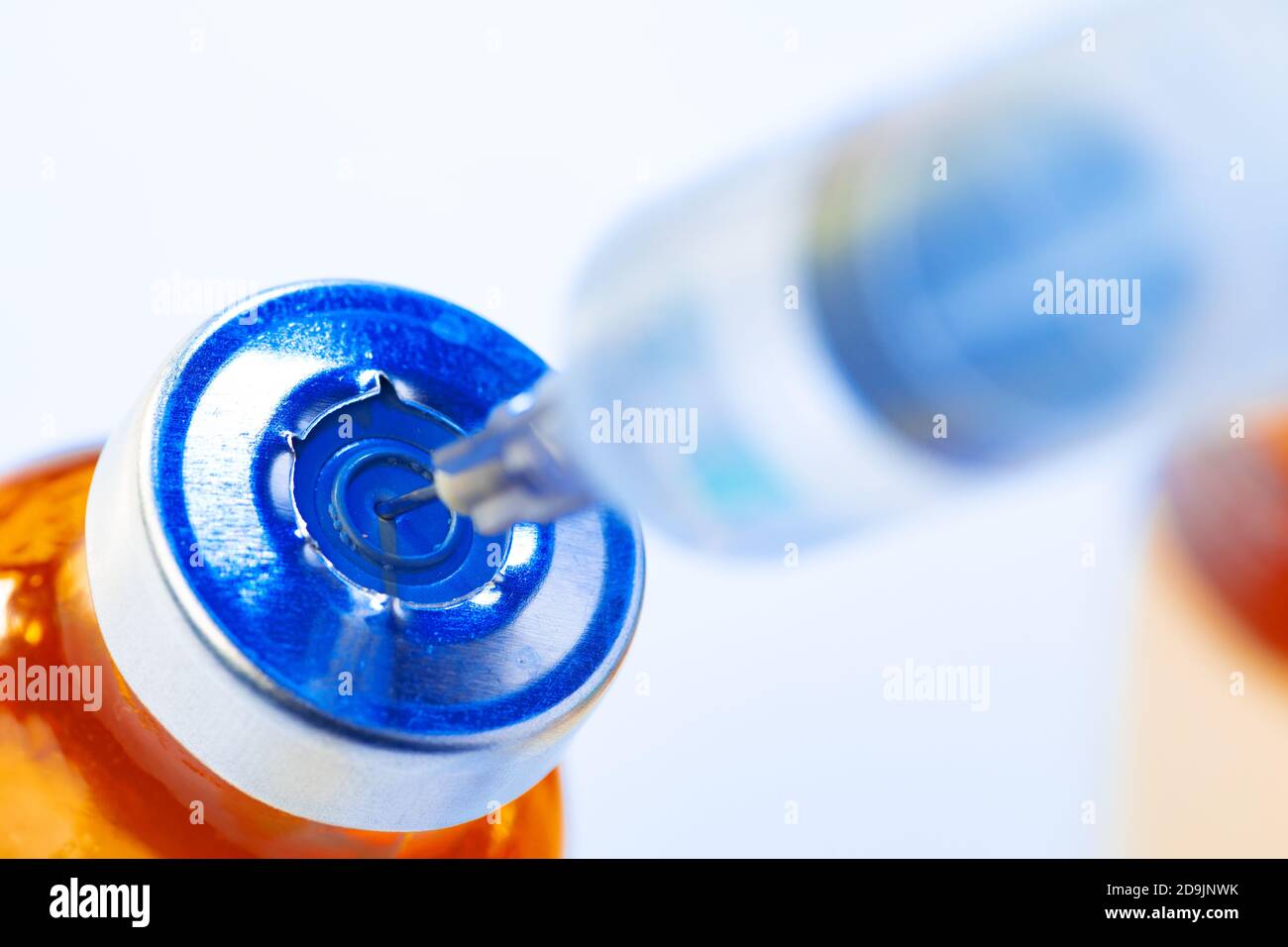 Medical vial with medication and syringe close up Stock Photo - Alamy