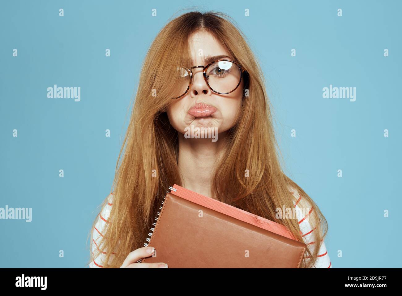 energetic female student with notepads and glasses model blue ...