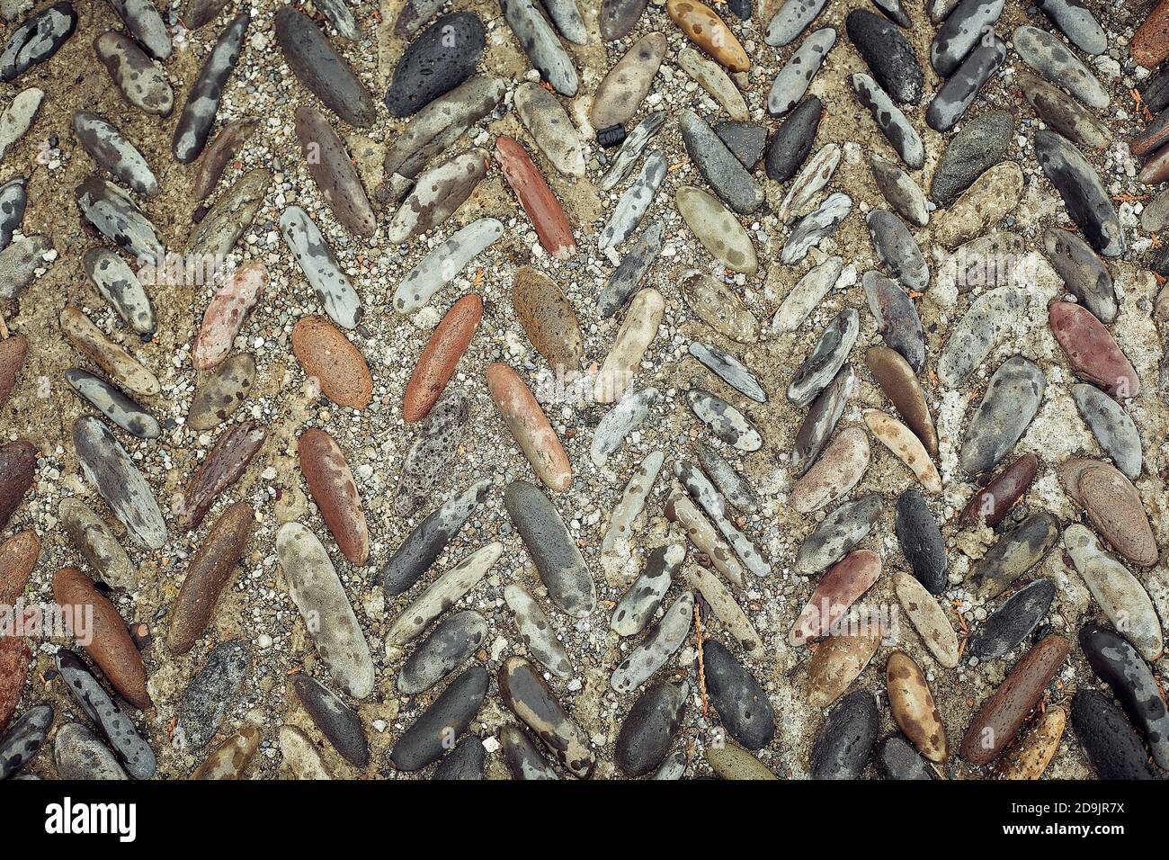 background of fine river stone, pavement lined with stone Stock Photo ...