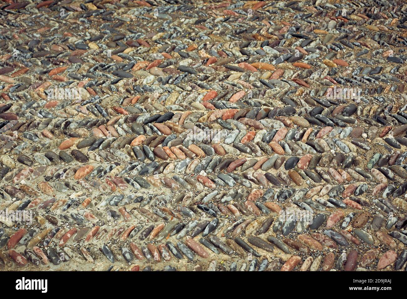 background of fine river stone, pavement lined with stone Stock Photo ...