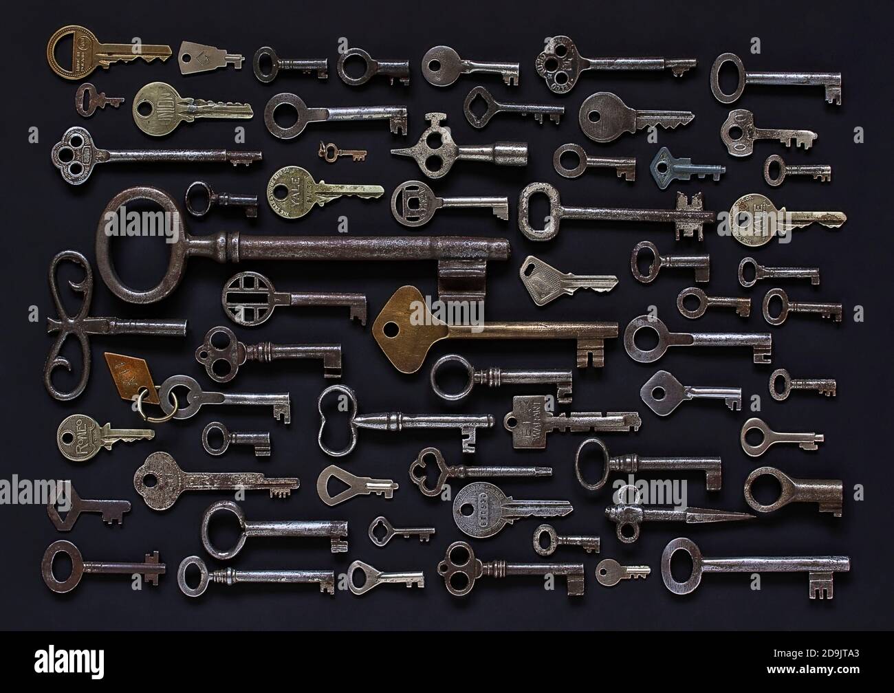 Set of old antique keys on a gray background Stock Photo - Alamy