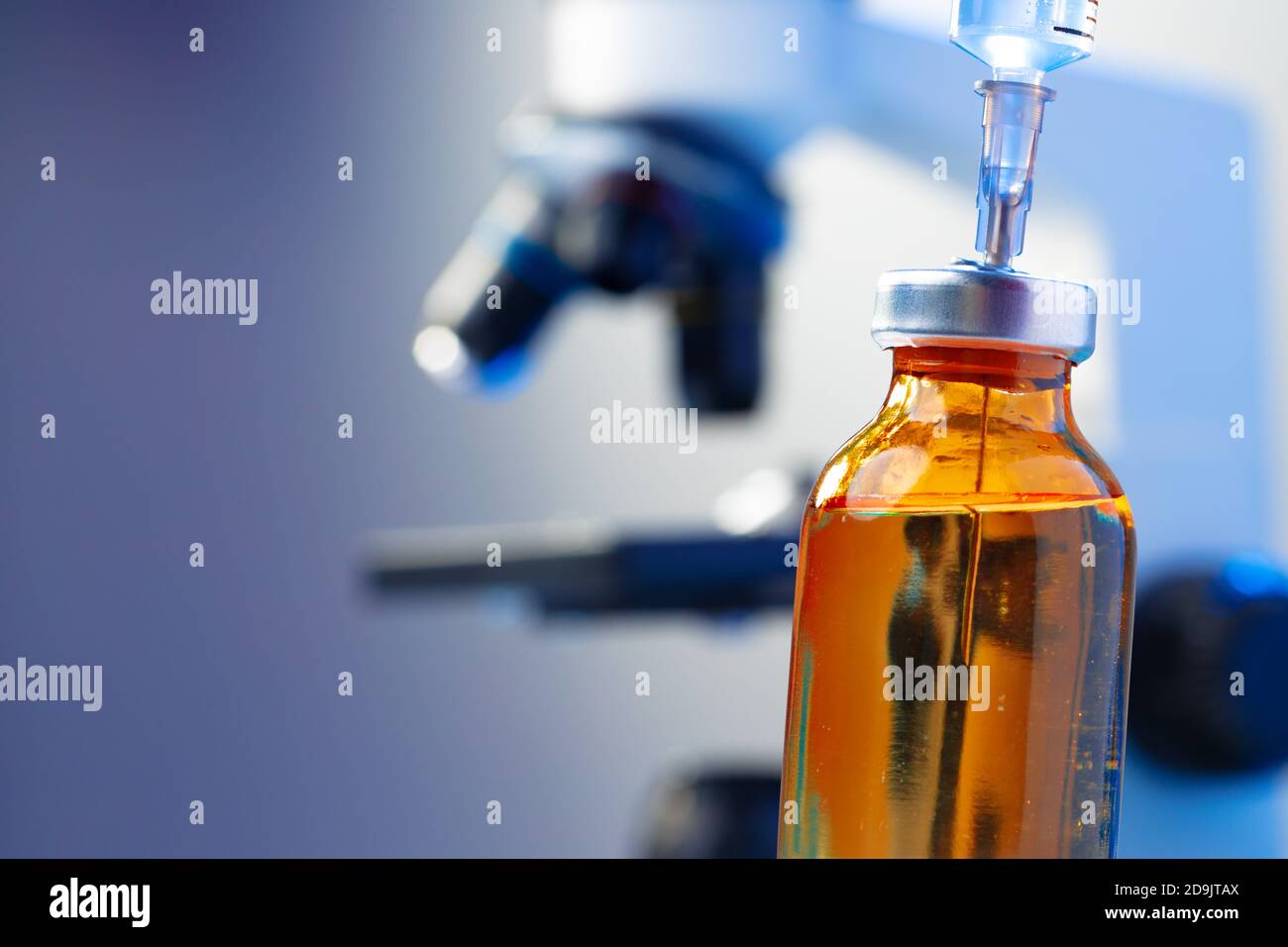 Medical vial with medication and syringe close up Stock Photo - Alamy