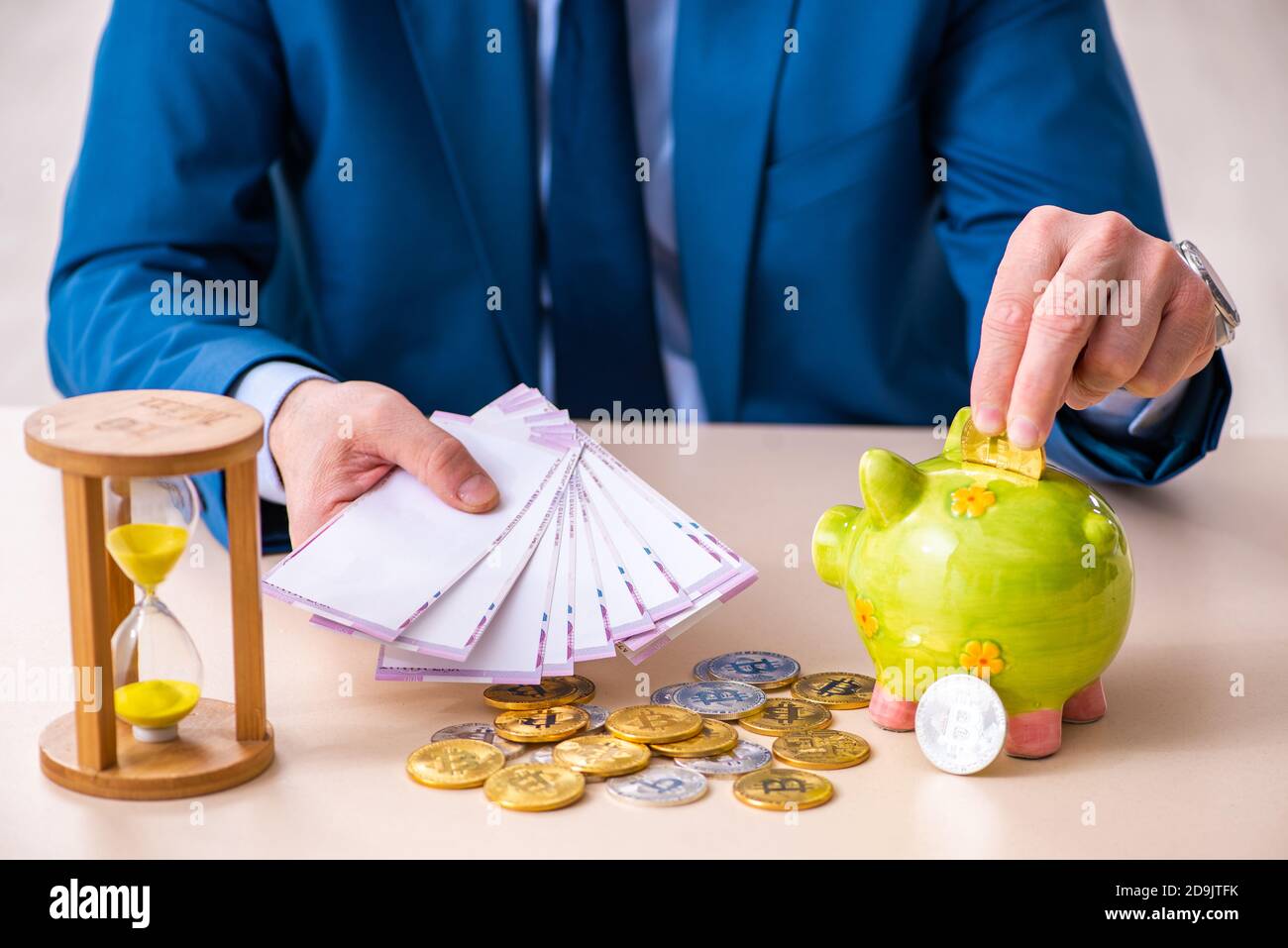 Old man earning money via internet in time management concept Stock ...