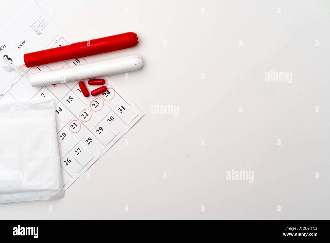 Menstruation calendar with sanitary pads and tampons, pills Stock Photo ...