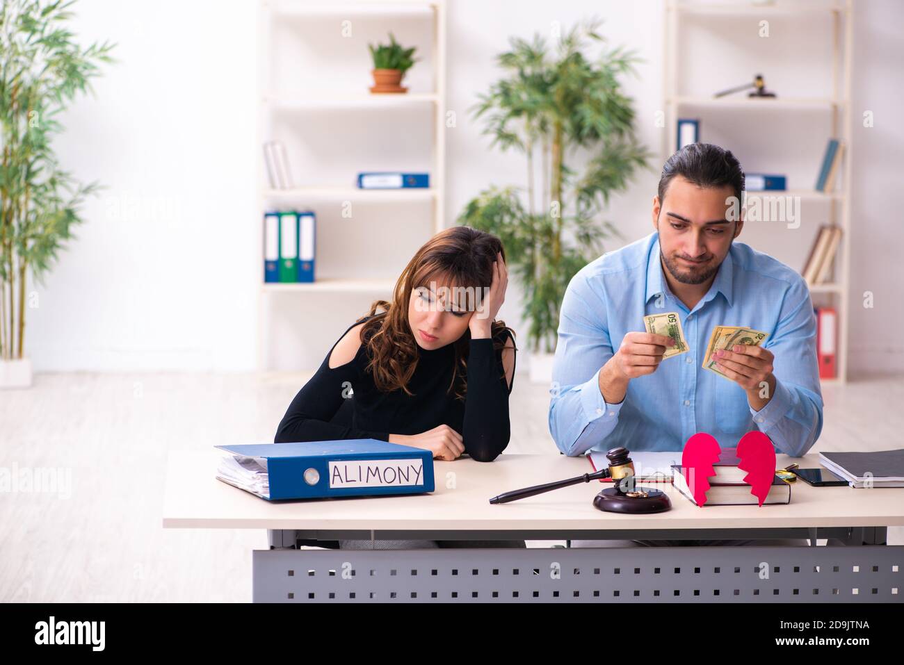 Couple divorcing in alimony concept Stock Photo - Alamy