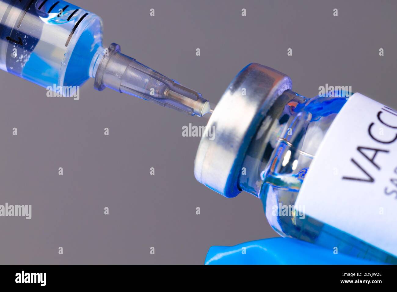 Medical vial with medication and syringe close up Stock Photo - Alamy