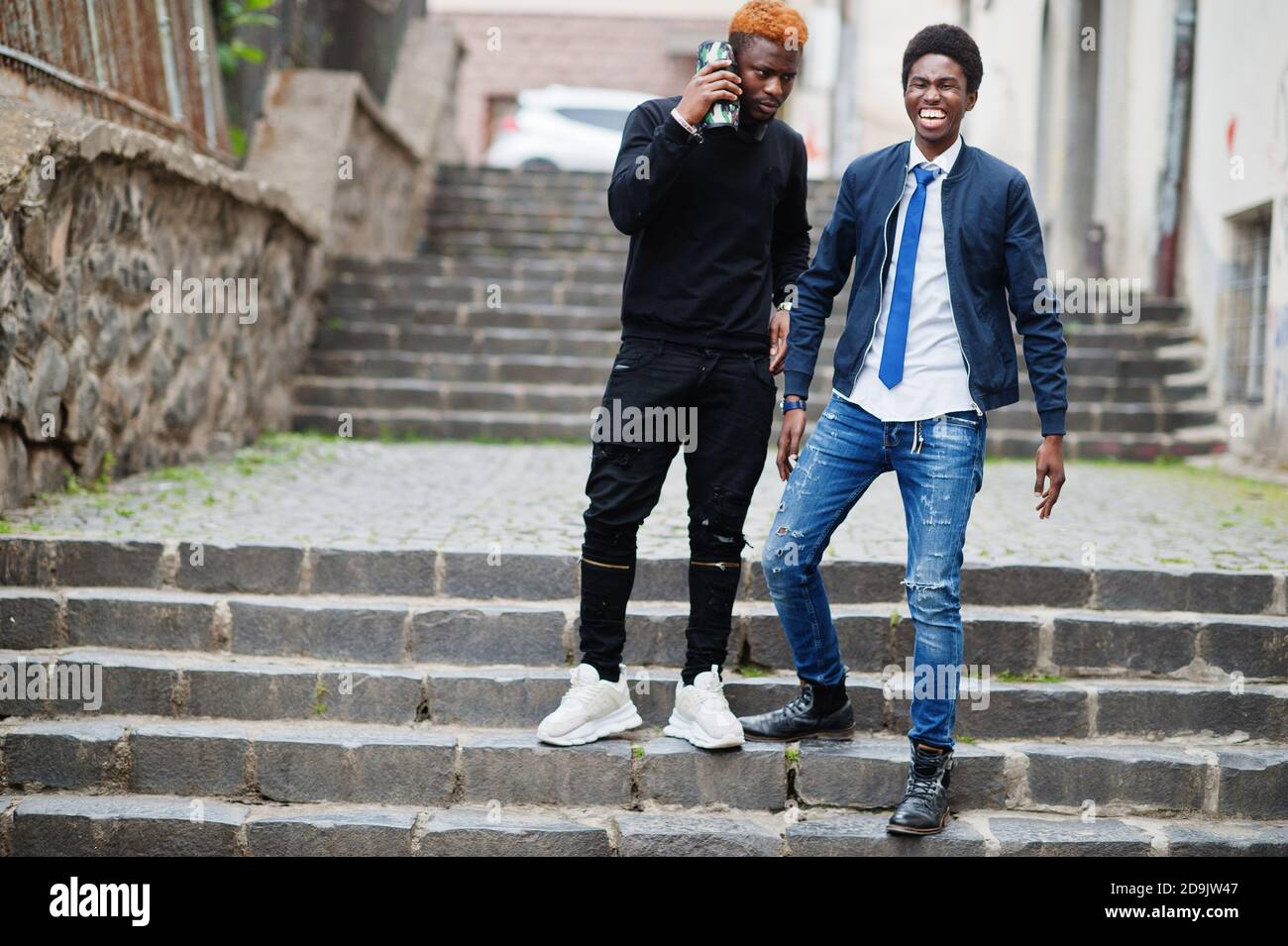 Two afircan man friends having fun outdoor Stock Photo - Alamy