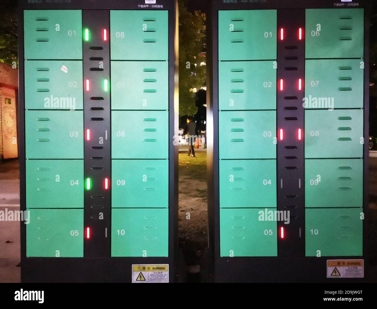 Two shared battery cabinets are placed outside a shopping mall for ...