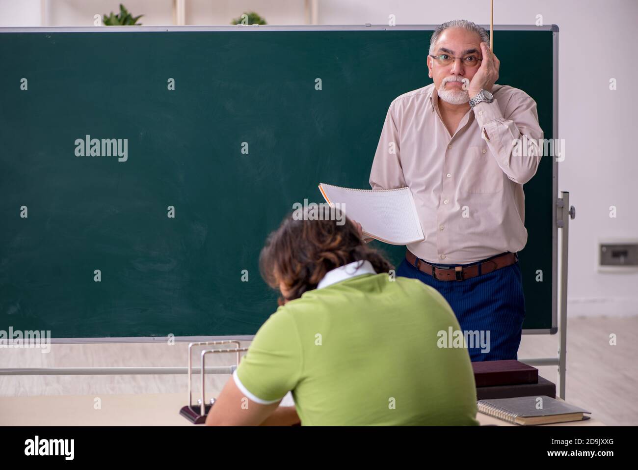 Old professor physicist and student in the classroom Stock Photo - Alamy