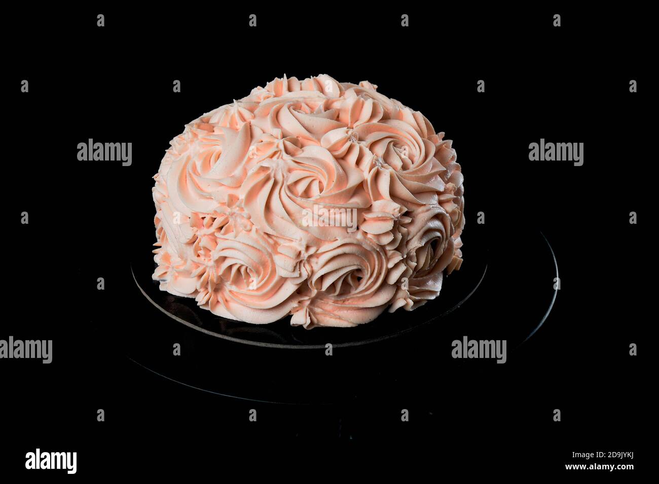 Delicious, airy pink cake on a black background. Cream tord for cake ...