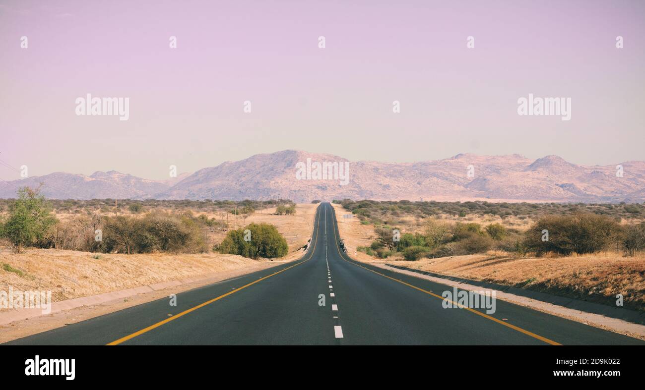 Highway passing through desert hi-res stock photography and images - Alamy