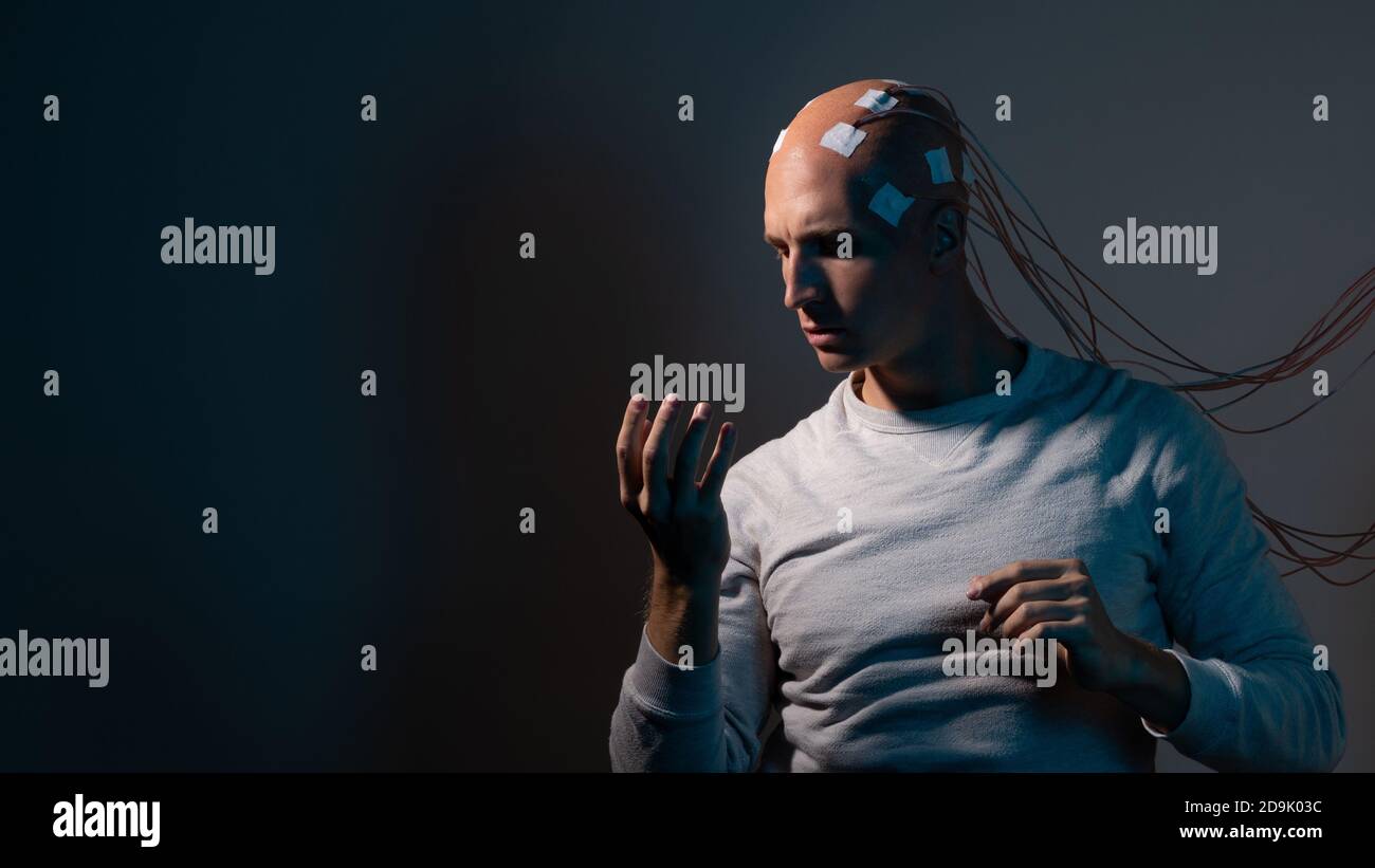Man with electrodes in his head is a futuristic concept of virtual ...