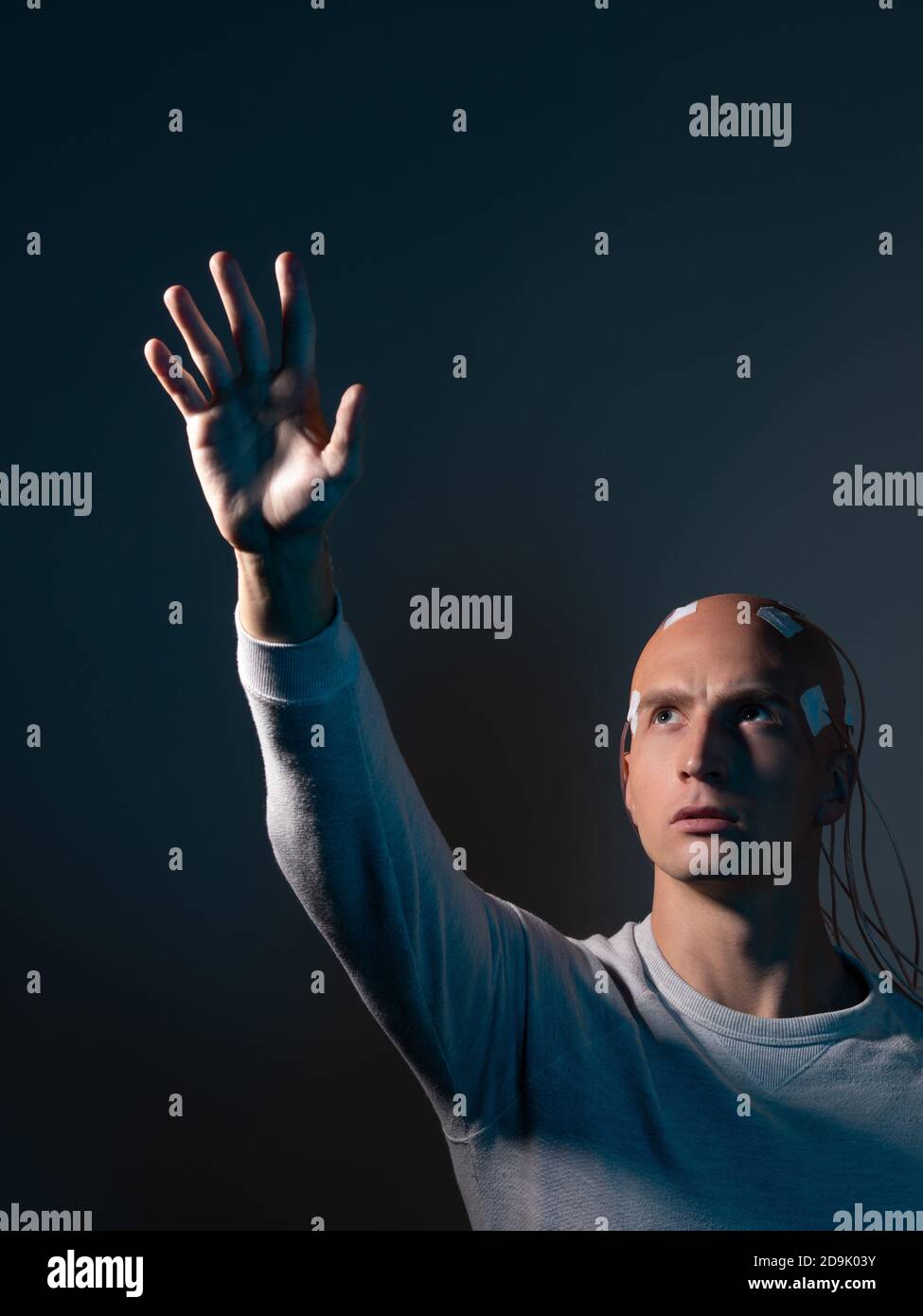 Bald man with electrodes in his brain , futuristic concept, cyber punk ...