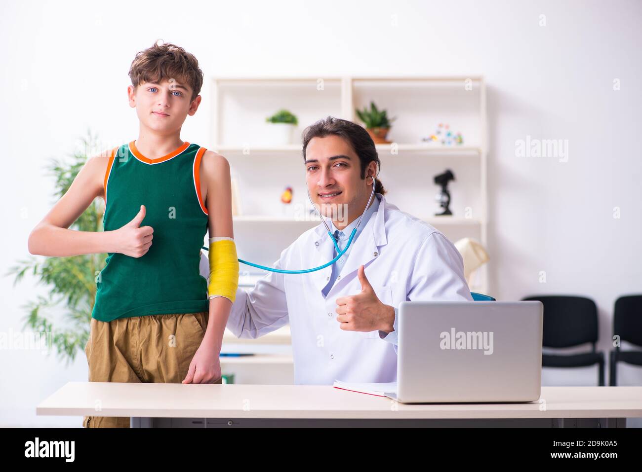 Sick boy visiting young doctor pediatrician Stock Photo - Alamy