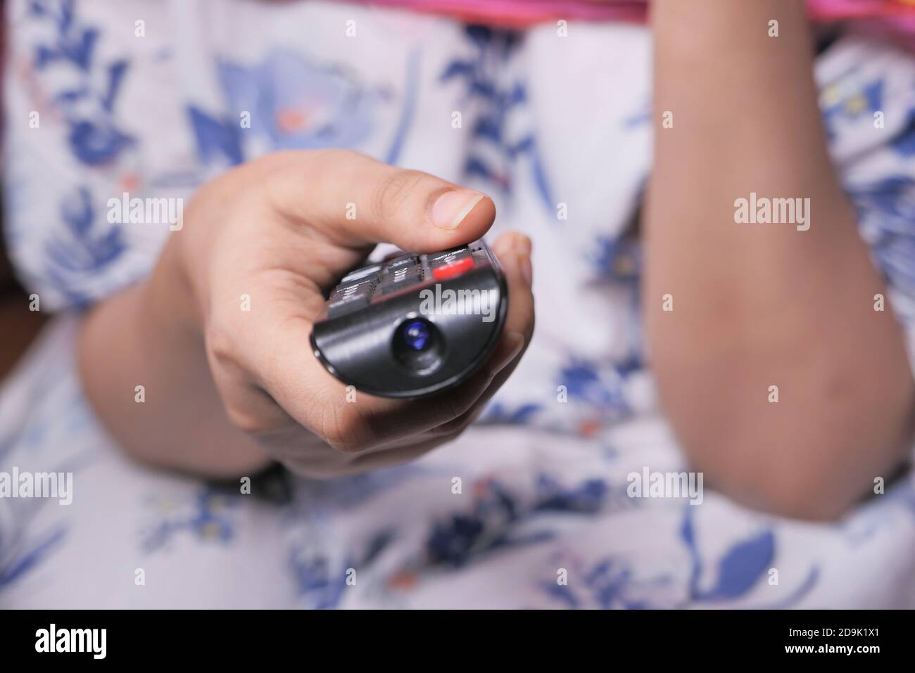 close up of women hand holding tv remote Stock Photo - Alamy