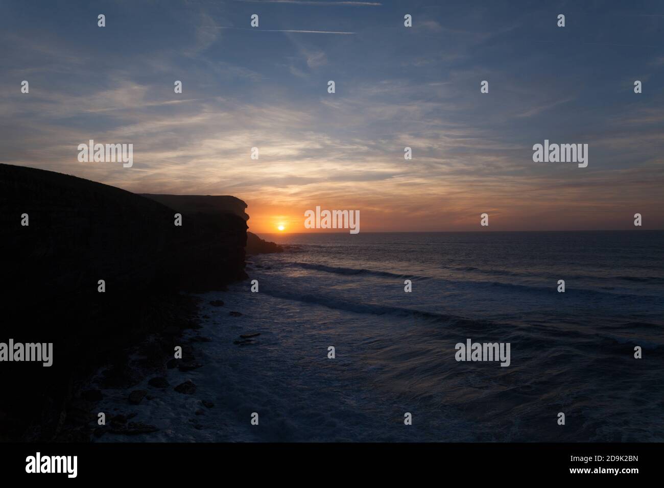 Amazing shot of a beautiful coastal cliff on a seaside sunset ...