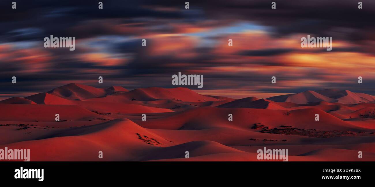Beautiful sand dunes and Clouds in motion. Long exposure at sunset ...