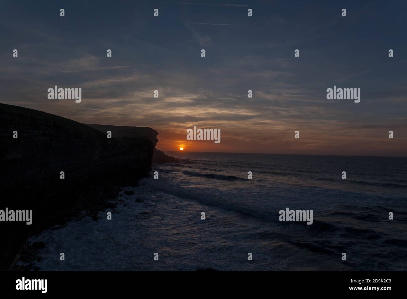 Amazing shot of a beautiful coastal cliff on a seaside sunset ...