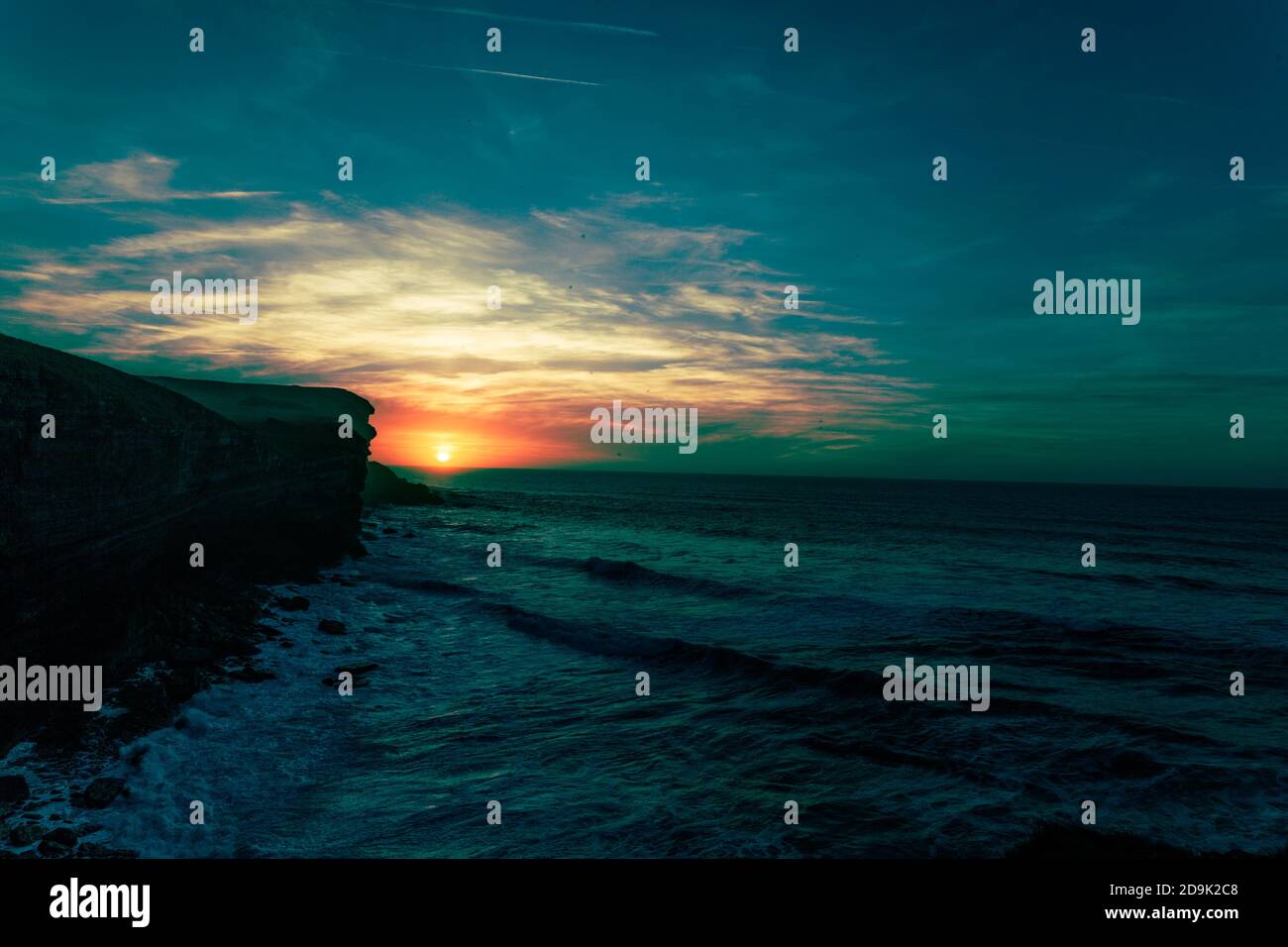 Amazing shot of a beautiful coastal cliff on a seaside sunset ...