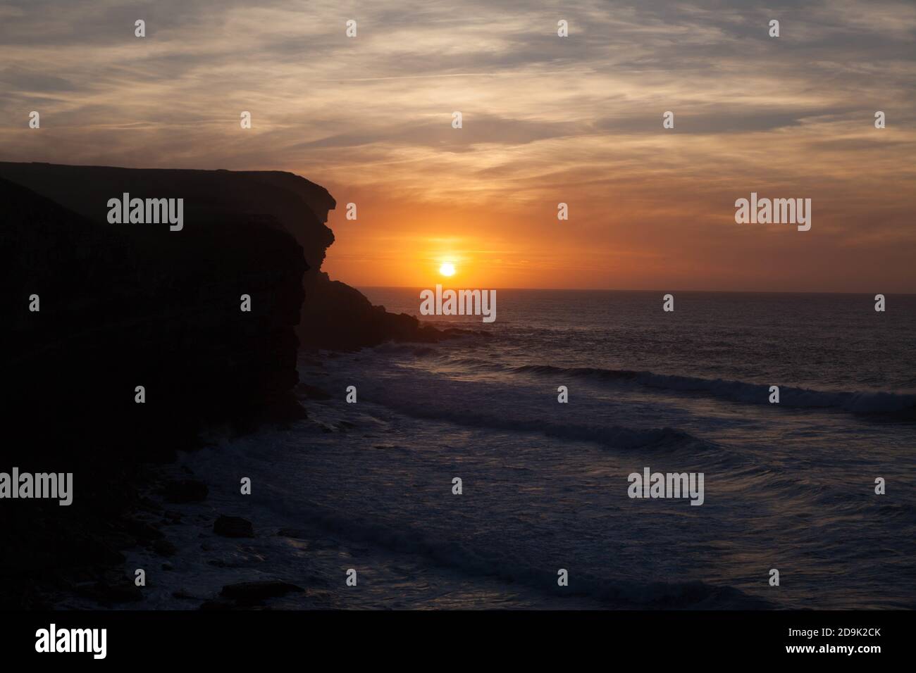 Amazing shot of a beautiful coastal cliff on a seaside sunset ...