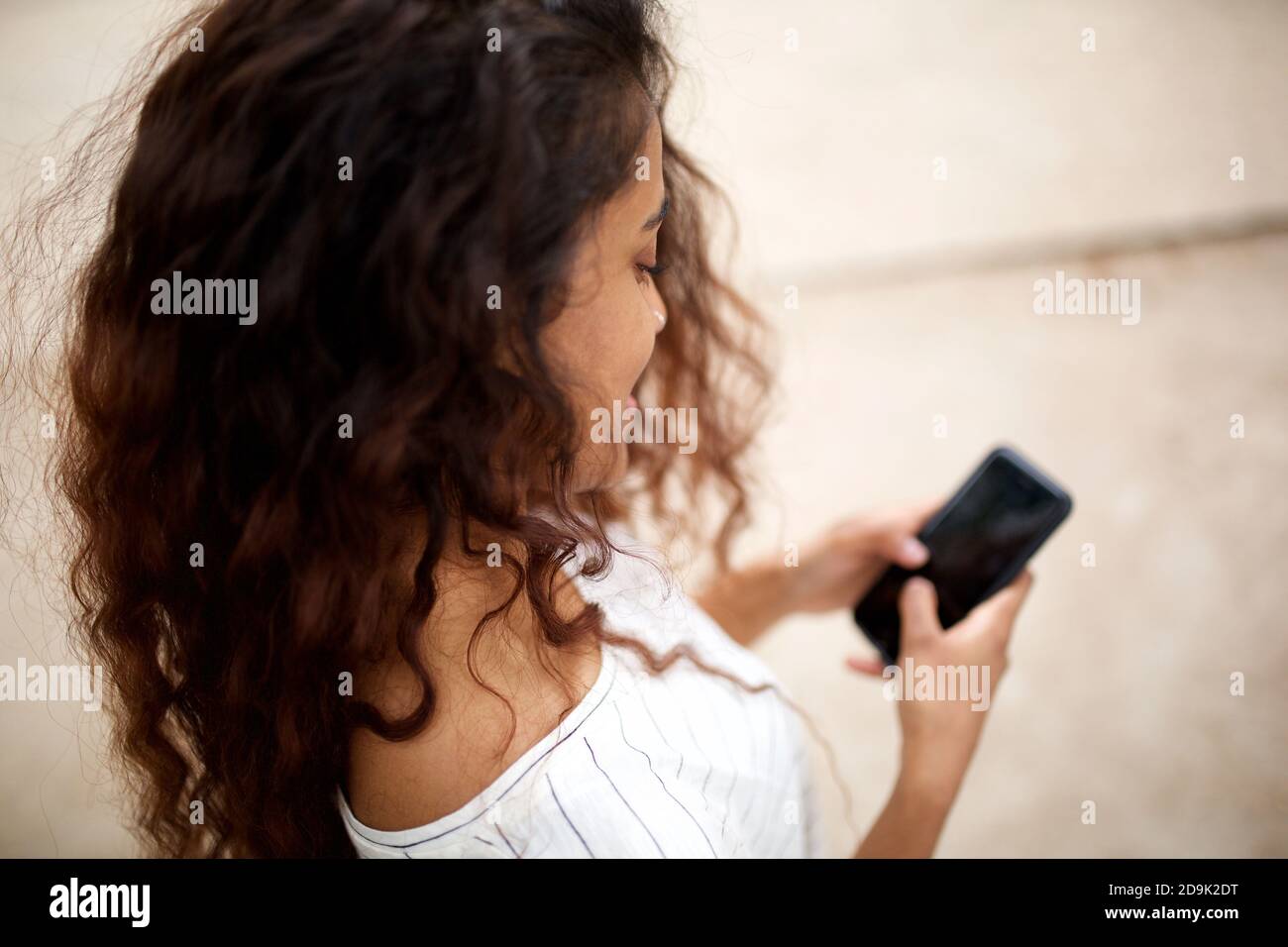 Close up portrait young woman holding mobile phone Stock Photo - Alamy