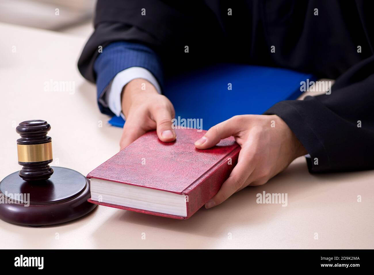 Young judge working in courthouse Stock Photo - Alamy