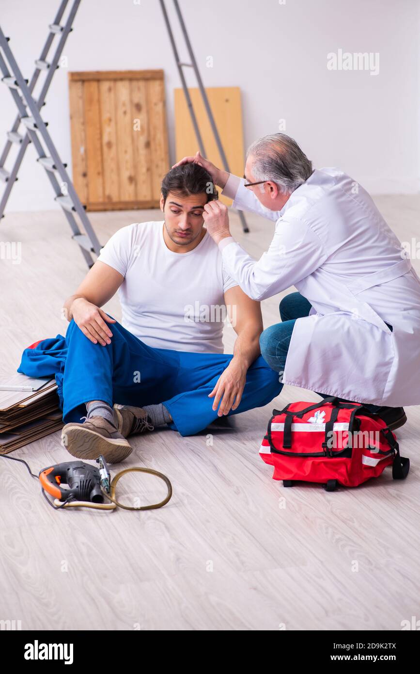 Experienced paramedic helping worker bitten by snake Stock Photo - Alamy