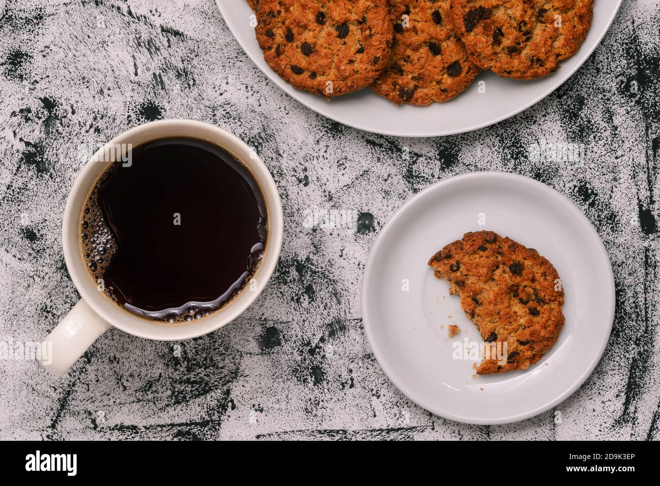 Brown biscuits, a cup of black coffee and a nibble of sweet homemade ...