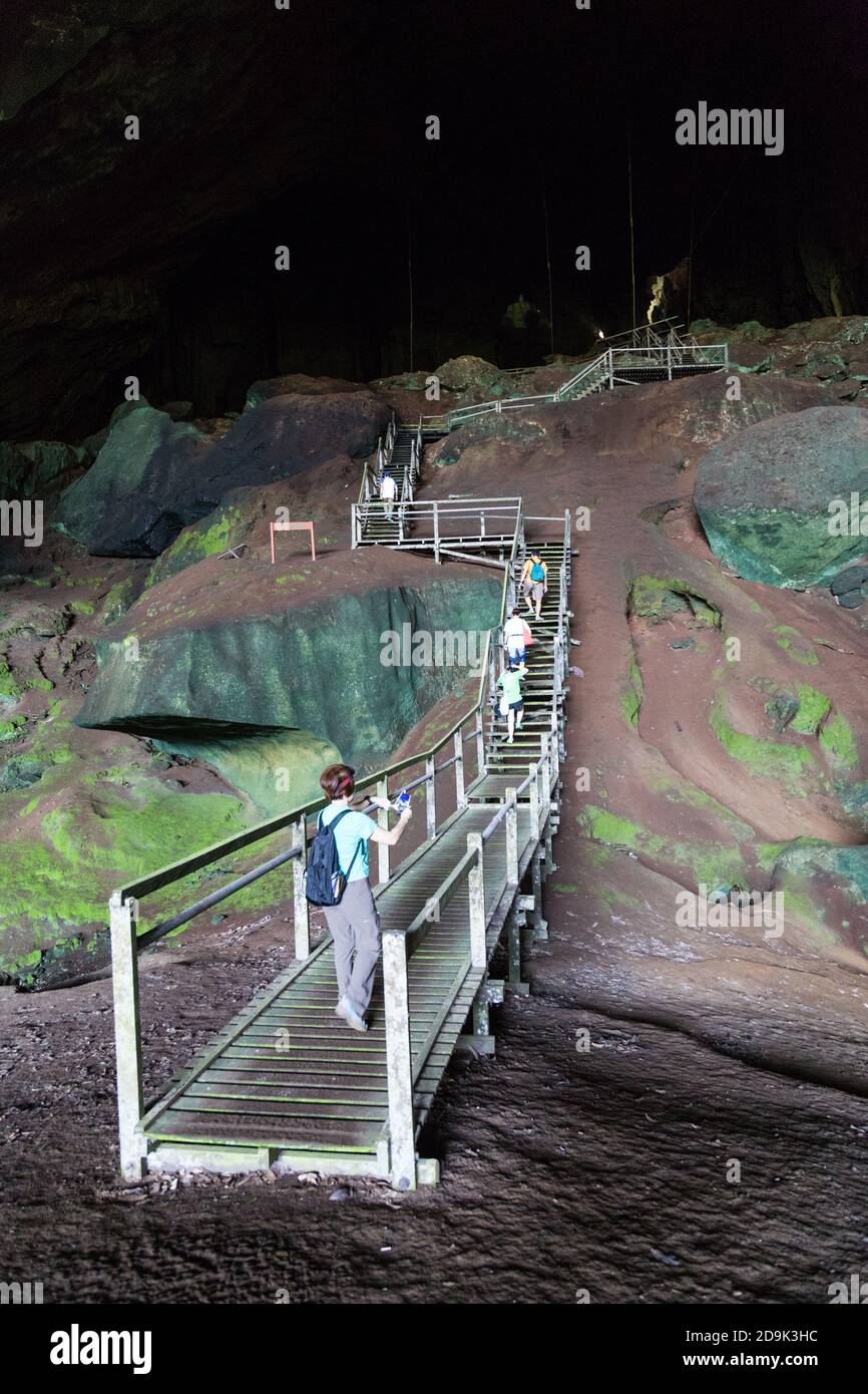 Path inside Great Caves chamber leading to pitch dark chambers Stock ...