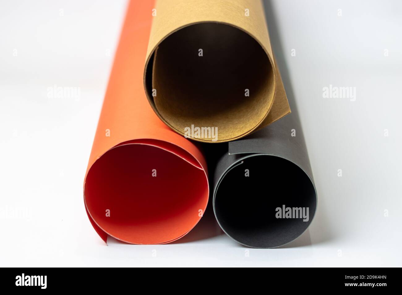 Rolled colorful textured art papers isolated on white background Stock ...