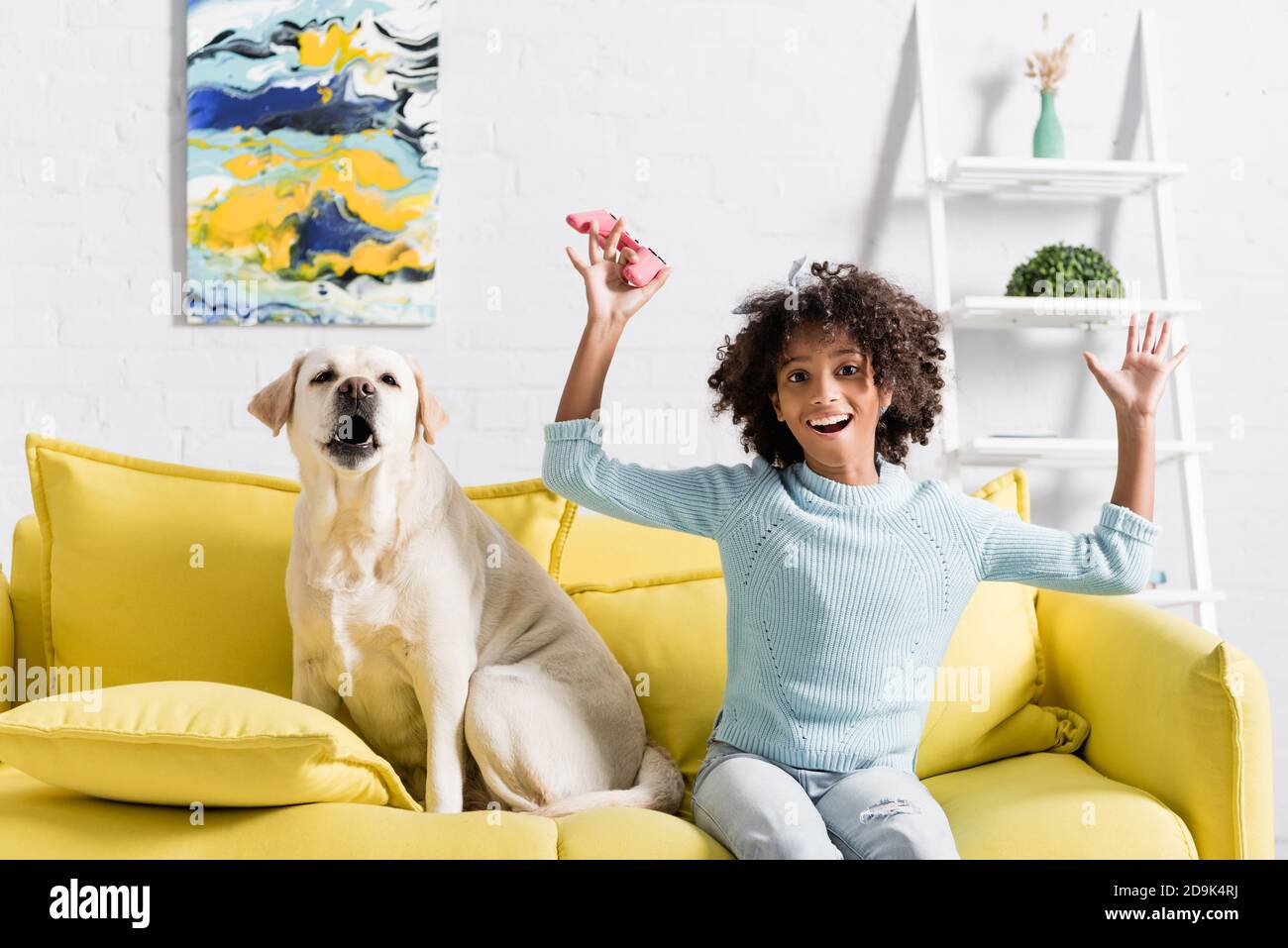 Girl with barking dog indoors hi-res stock photography and images - Alamy