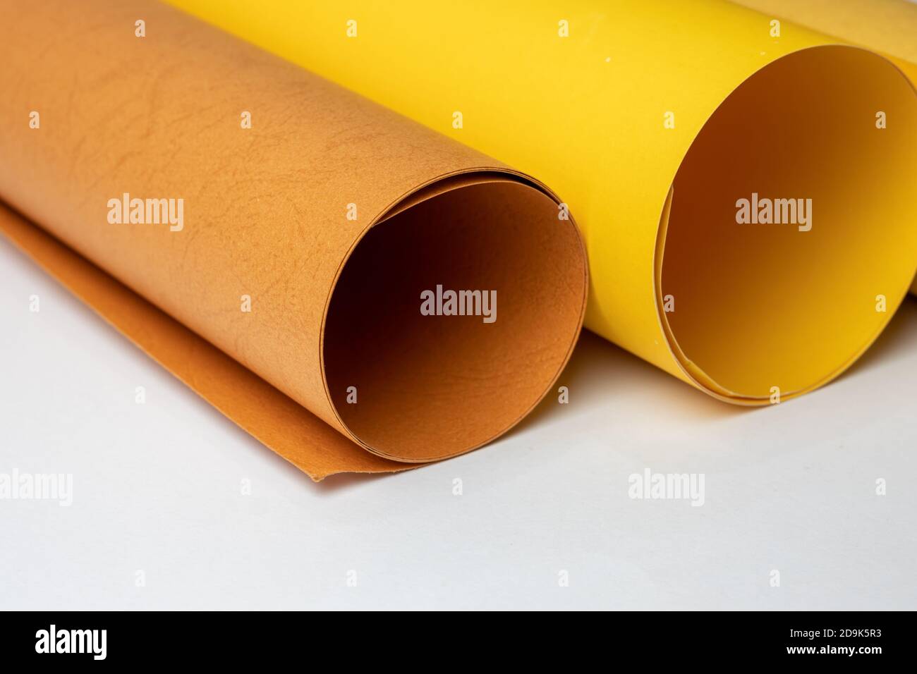 Abstract rolled sheet of colorful textured art paper isolated on white ...