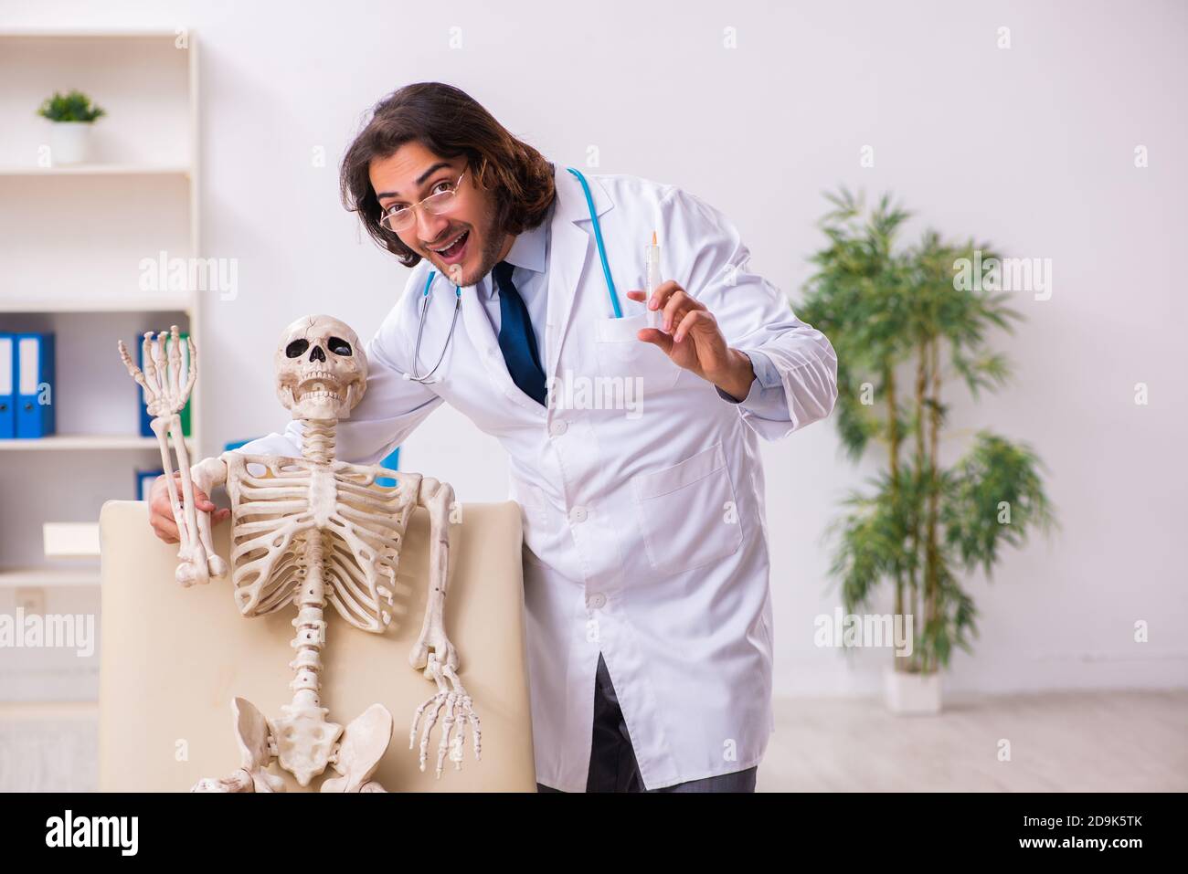 Crazy doctor examining the dead patient Stock Photo - Alamy