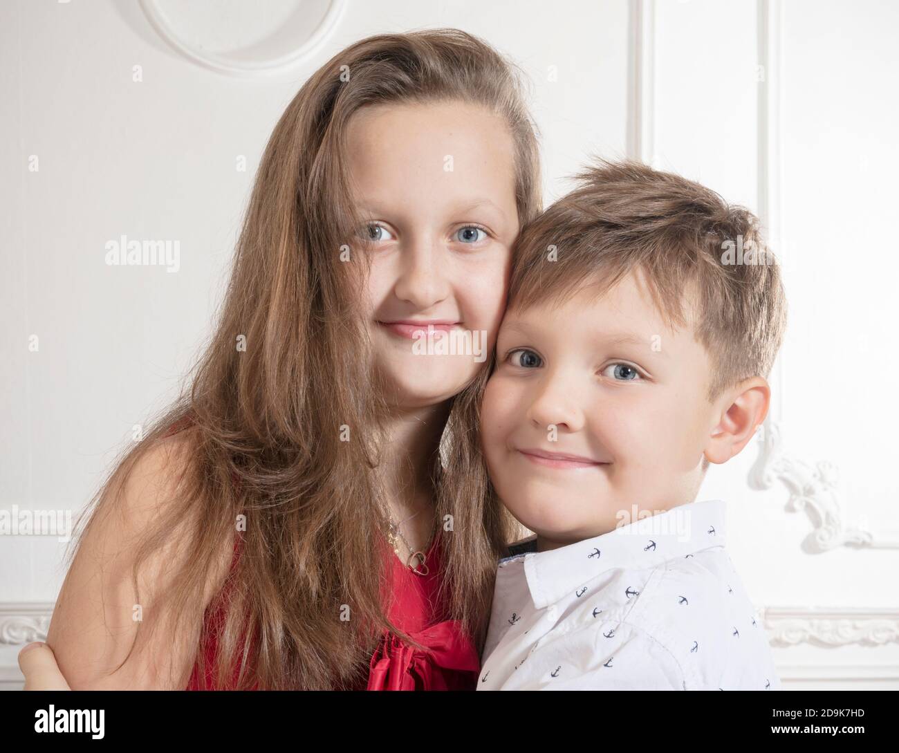 Cute brother and sister studio portrait Stock Photo - Alamy