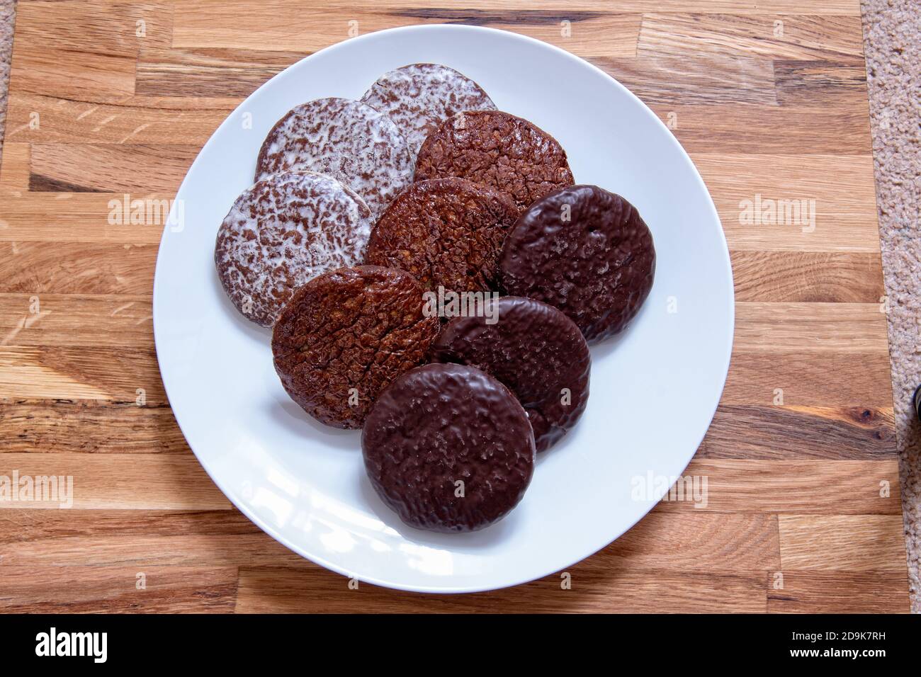 Three types of German round gingerbreads on white plate. Gingerbread ...